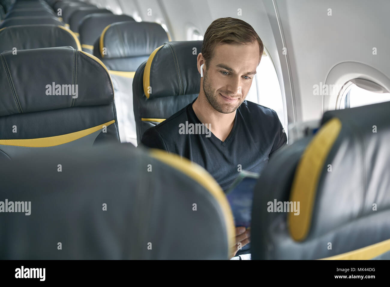 Handsome guy in airplane Stock Photo - Alamy