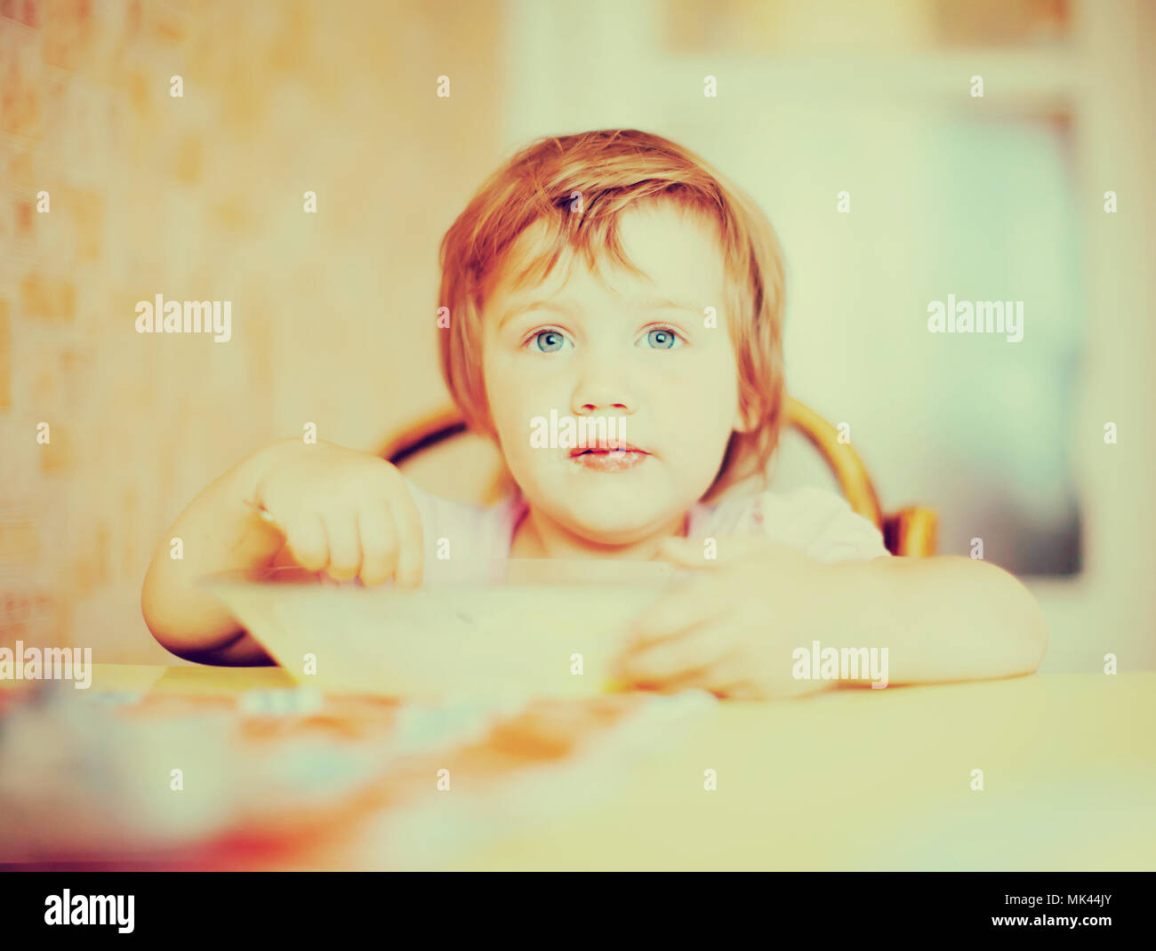 child eats with spoon in home Stock Photo - Alamy