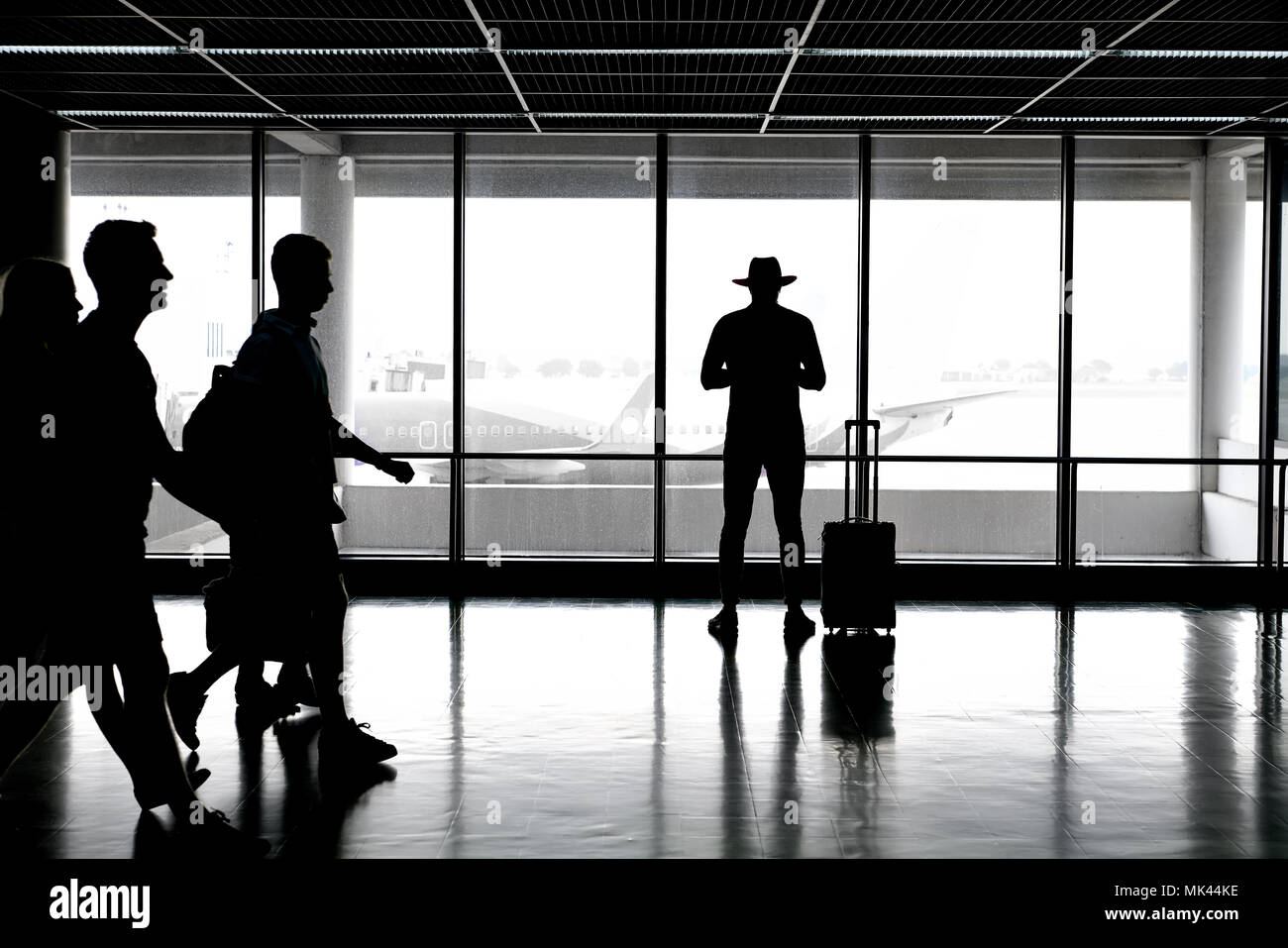 Passengers inside airport Stock Photo - Alamy