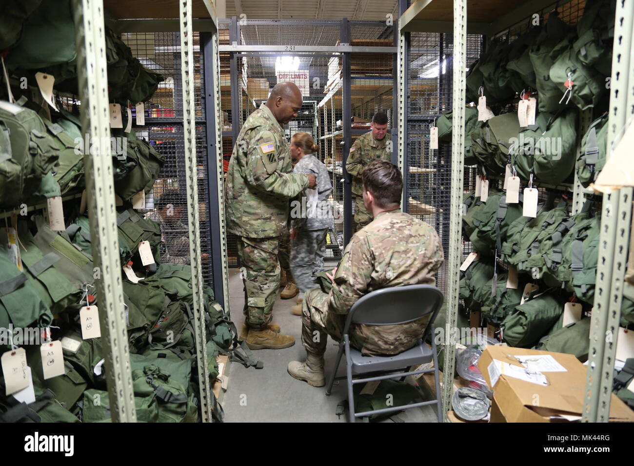 Soldiers with the 352nd Civil Affairs Command conduct a mask issue and ...