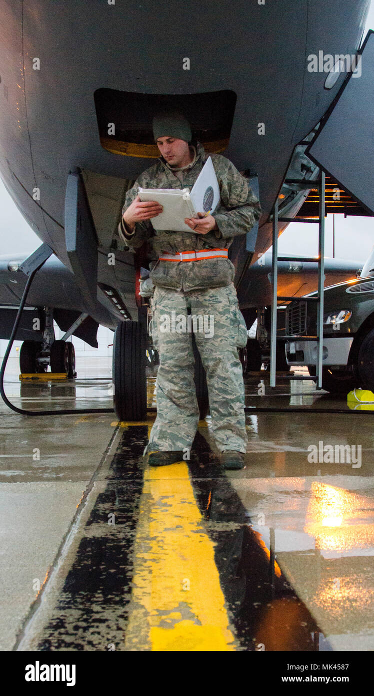 An Airmen reviews a pre-flight instruction binder during a generation ...