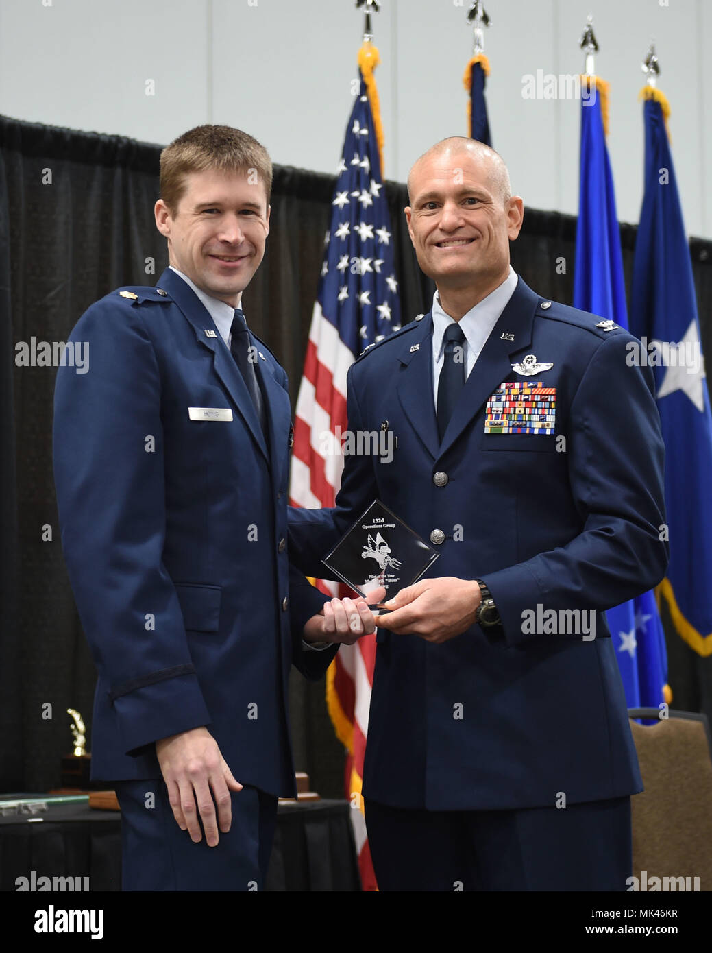Col. Shawn D. Ford poses with Maj. Erik “Boss” Howg, who was awarded ...