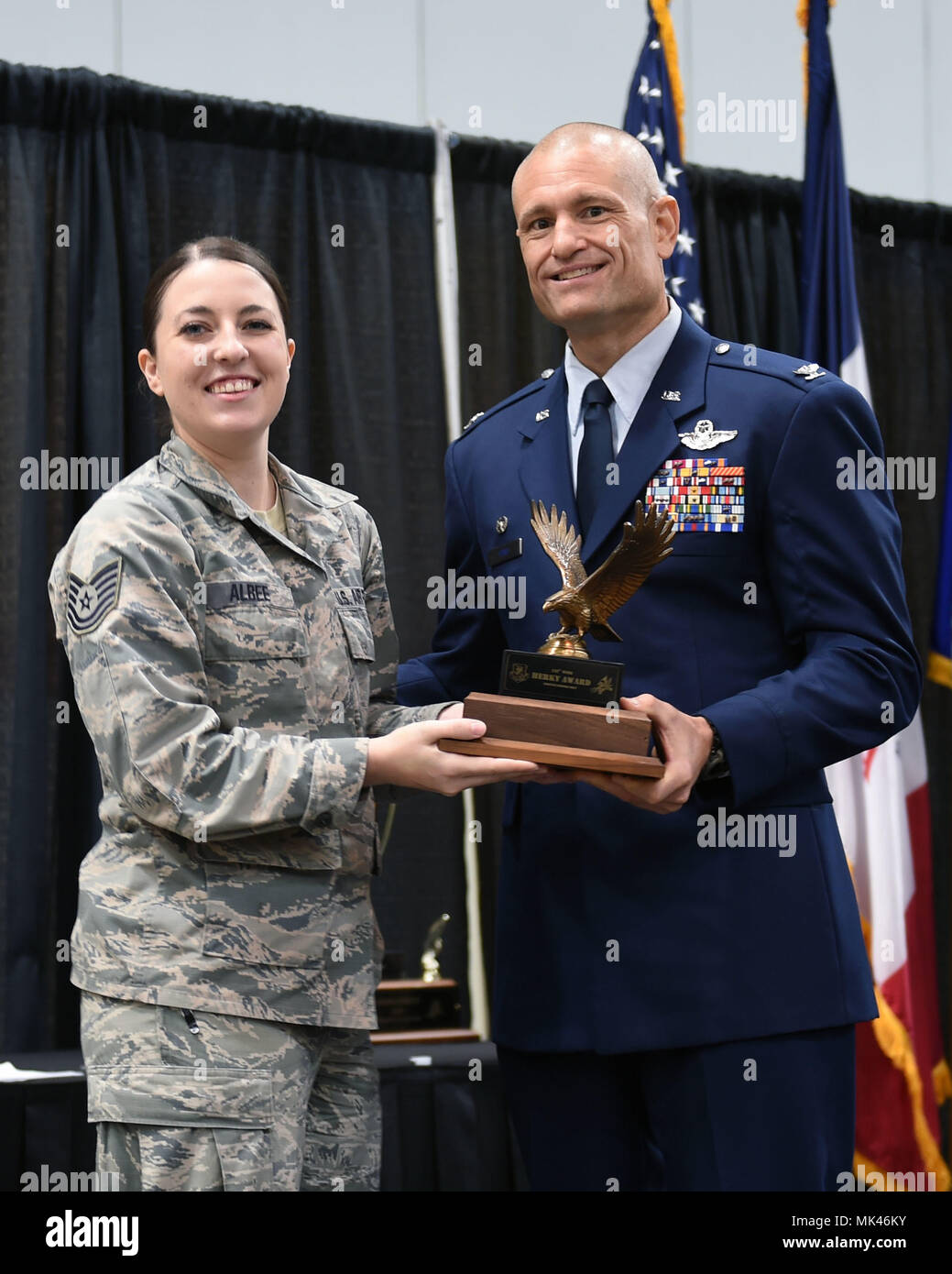 Col. Shawn D. Ford poses with Tech. Sgt. Rachel Albee, who was awarded ...