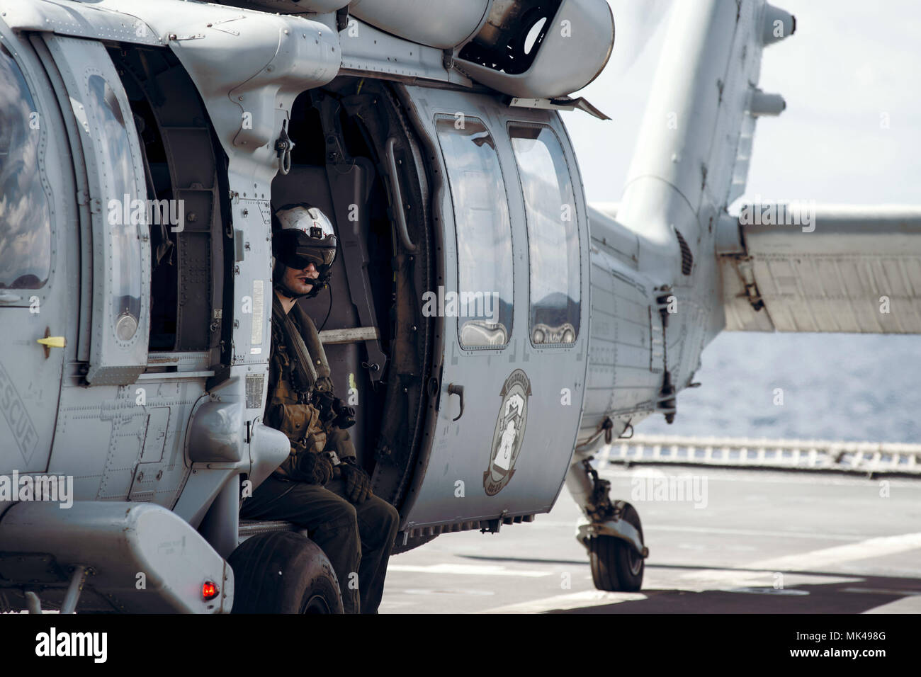 Naval Aircrewman (Helicopter) 2nd Class Jeff Marr stands by for take ...