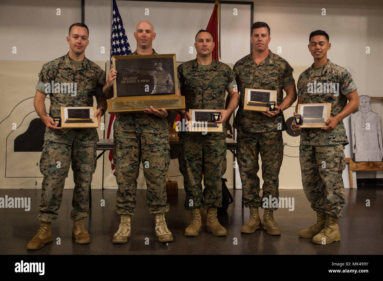 U.S. Marines with the U.S. Marine Forces, Pacific (MARFORPAC) shooting team, present their ...
