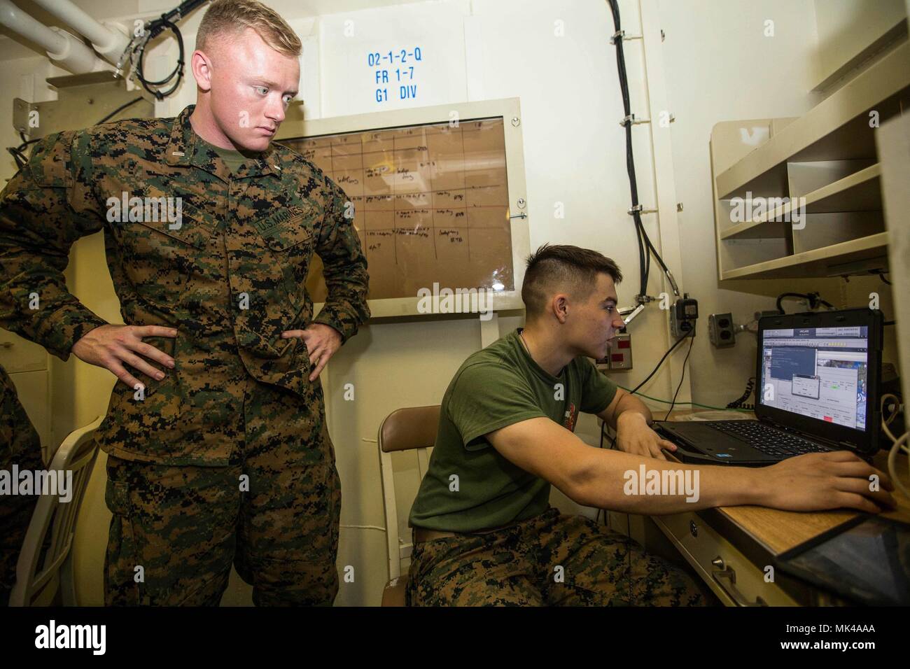 U.S. Marine 1st Lt. Matthew Shimp, left, a field artillery officer with ...