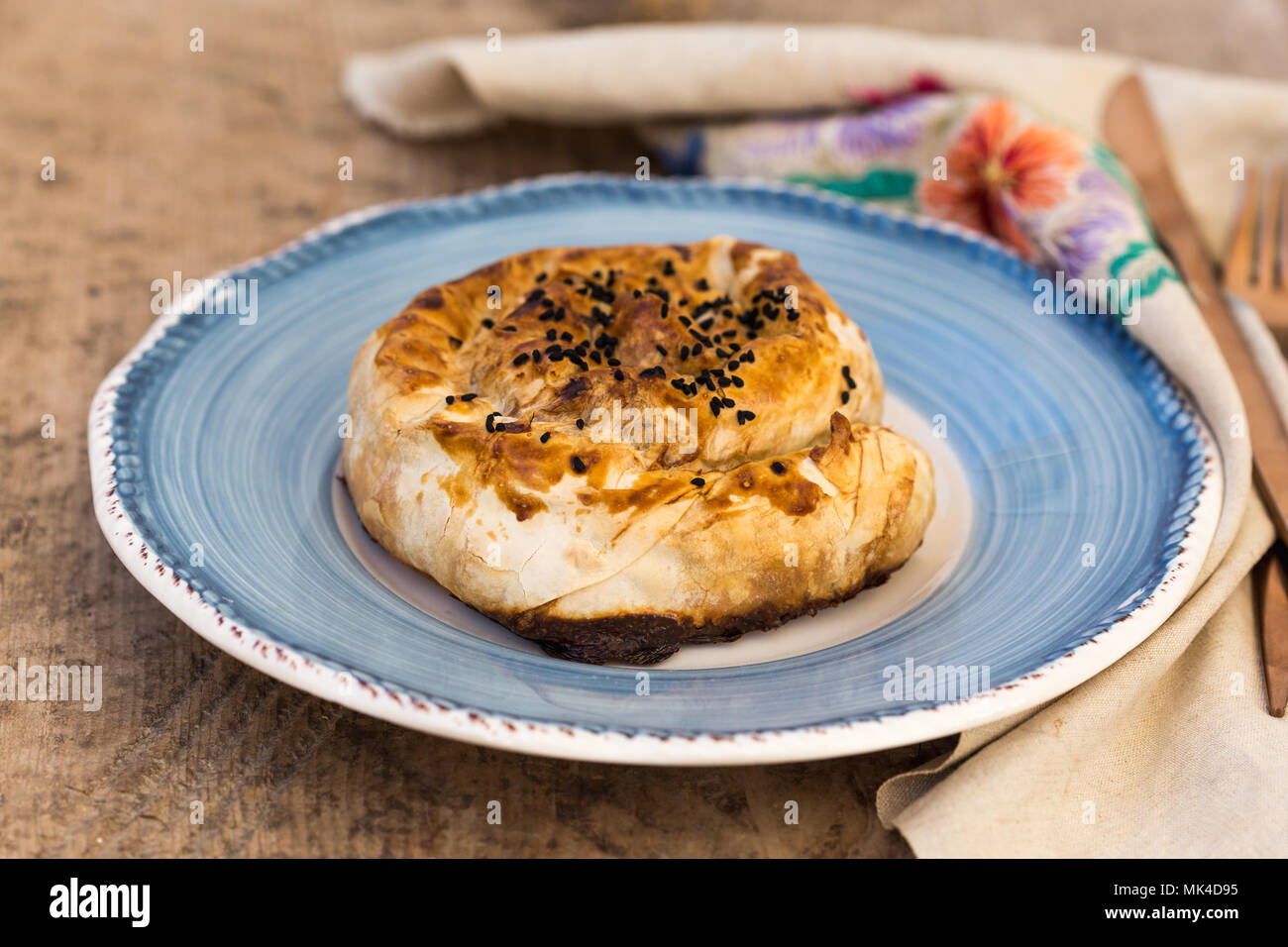 Turkish pastry in blue creamic plates on wooden tabletop Stock Photo ...