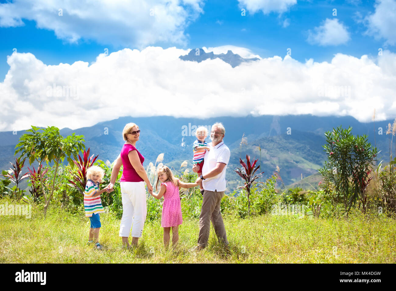 Grandparents and children hiking in mountains. Parents and kids ...