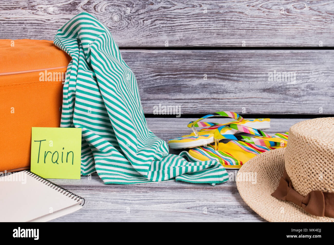 Female summer holiday clothes. Wooden desk surface background Stock ...