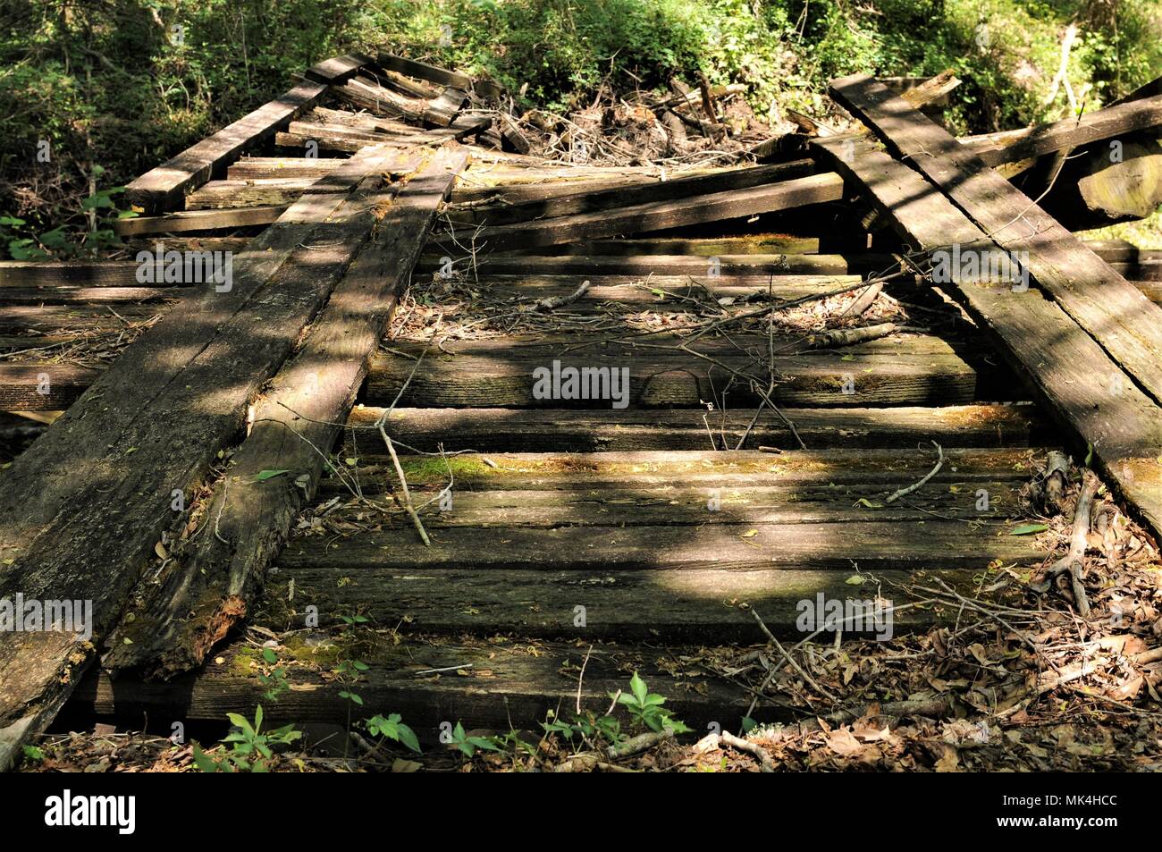 Collapsing dilapidated old farm bridge in the Mississippi countryside ...