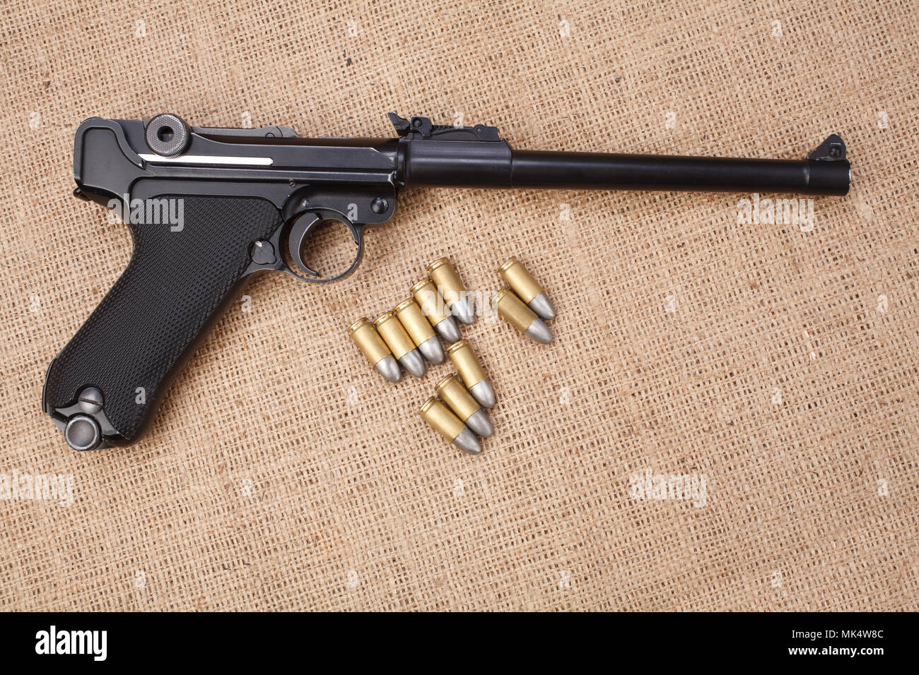 World War I period german army handgun with cartridges on canvas ...