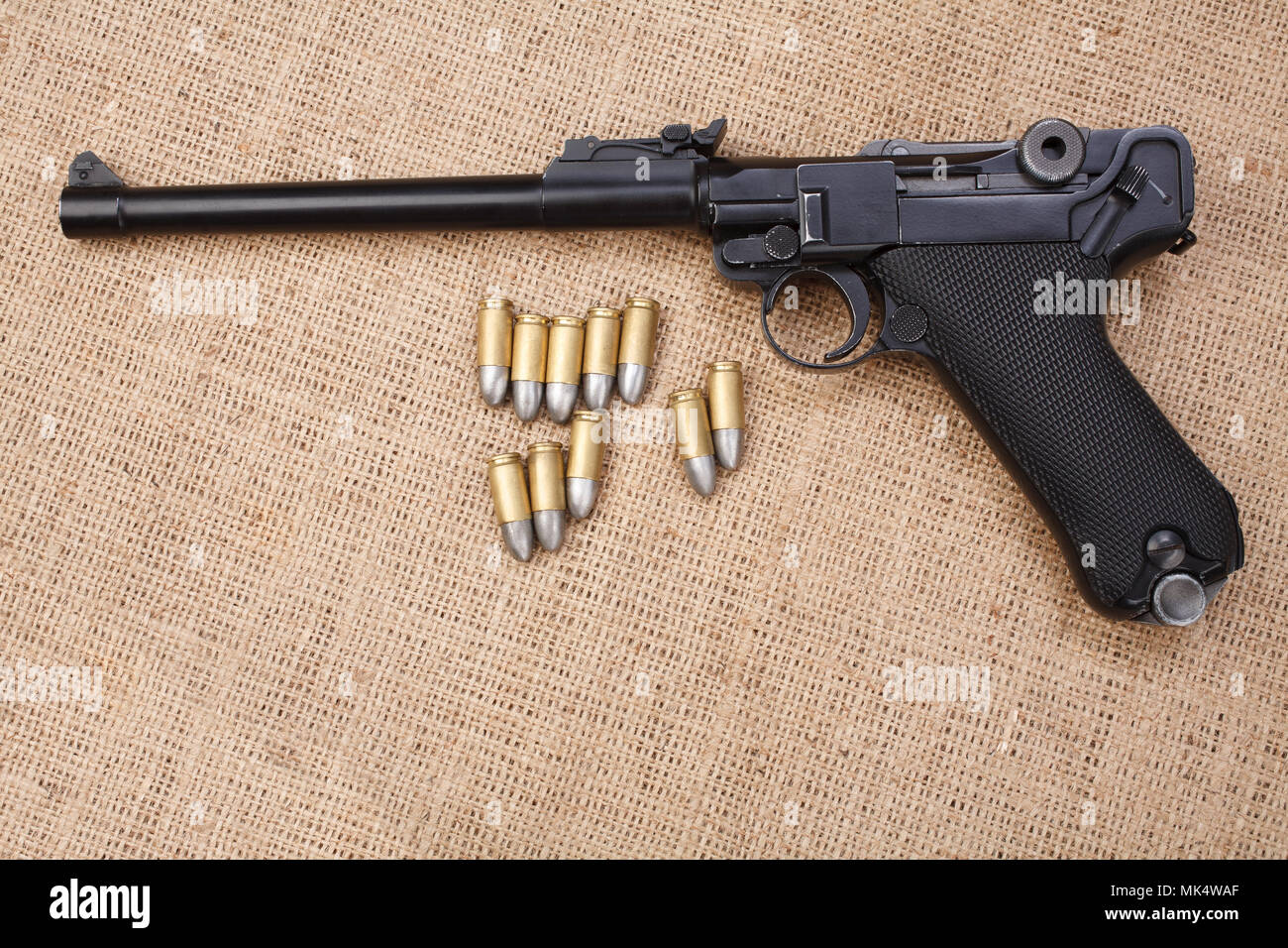 World War I period german army handgun with cartridges on canvas ...