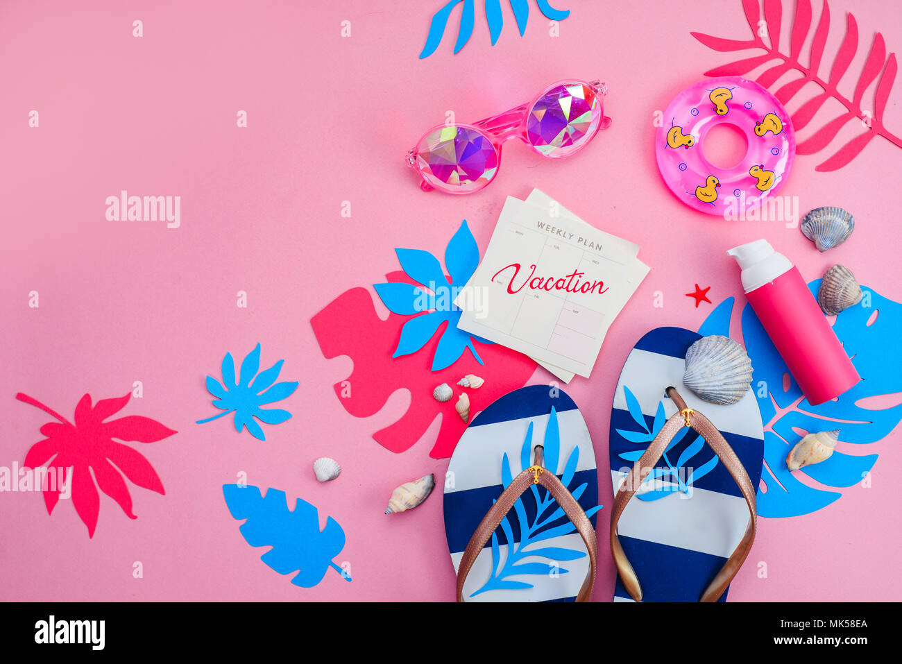 Feminine summer vacation essentials concept. Flip flops, sunglasses and ...