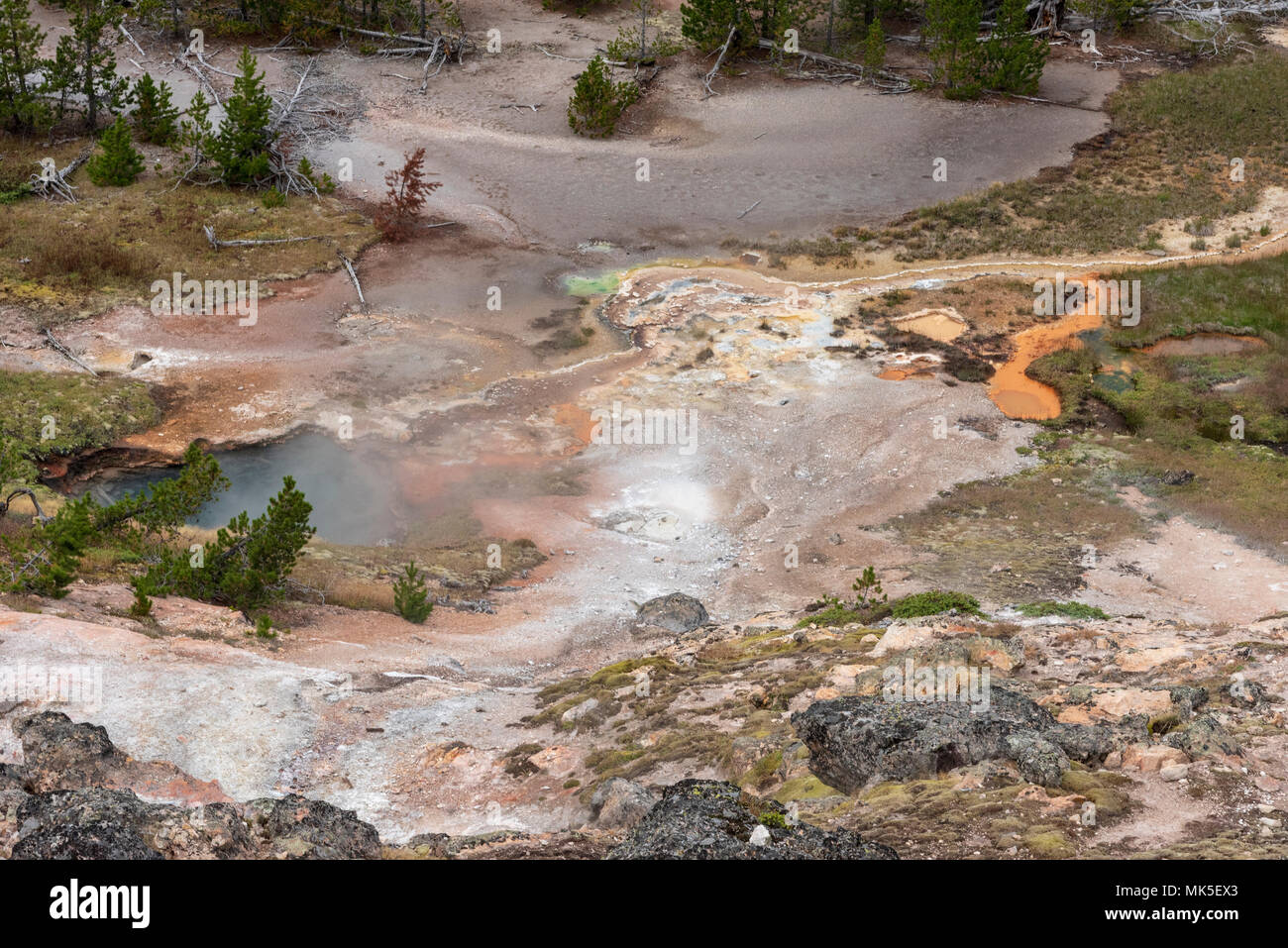 Looking down into a valley of hot springs and colorful terrain Stock ...