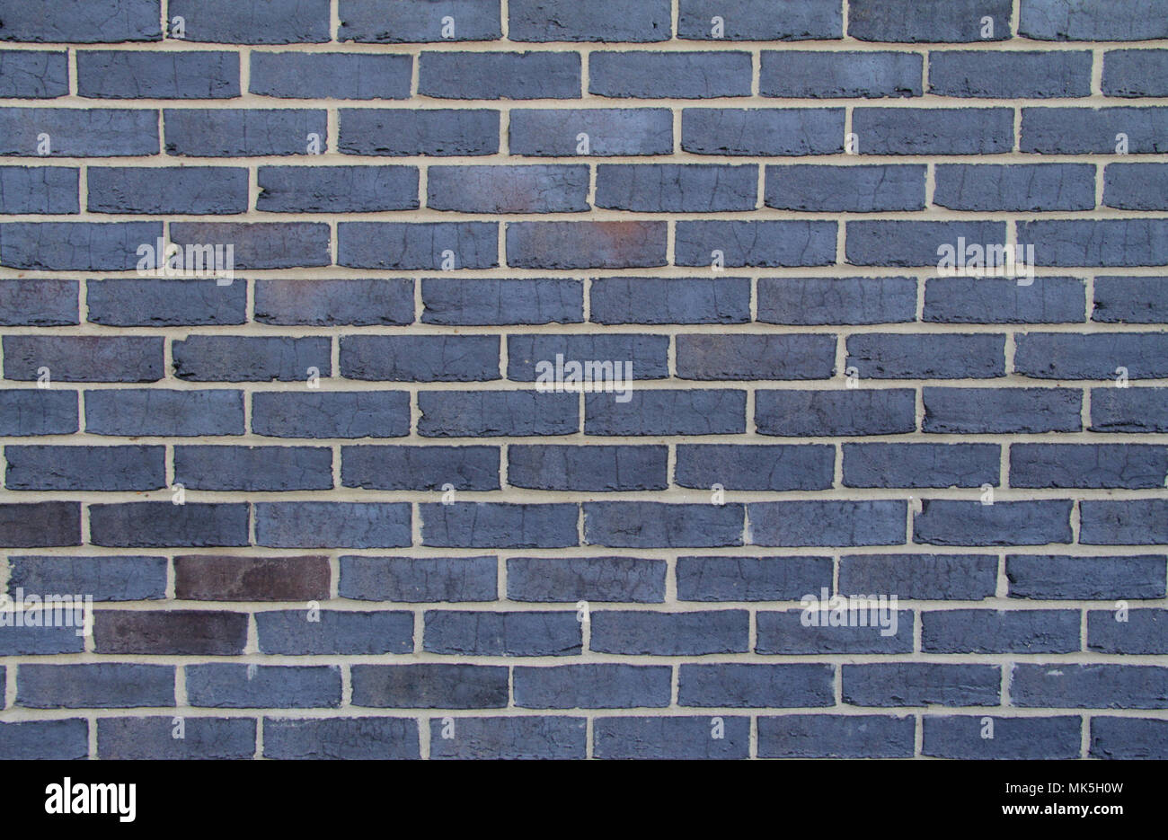 Dark Grey Brickwork Brick Wall with brown mortar Stock Photo - Alamy