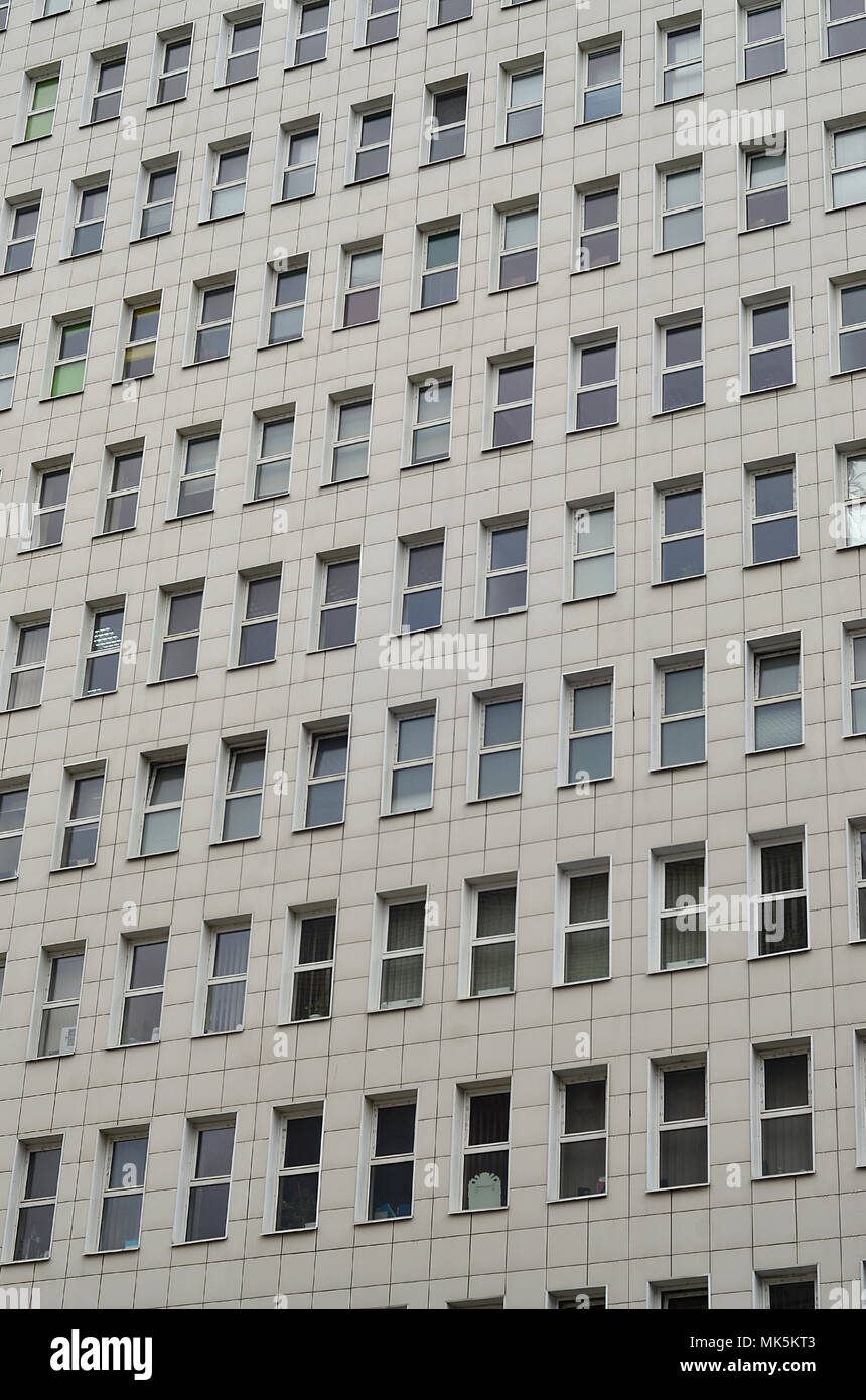 A pattern of many windows from a multi-storey office building. A large ...