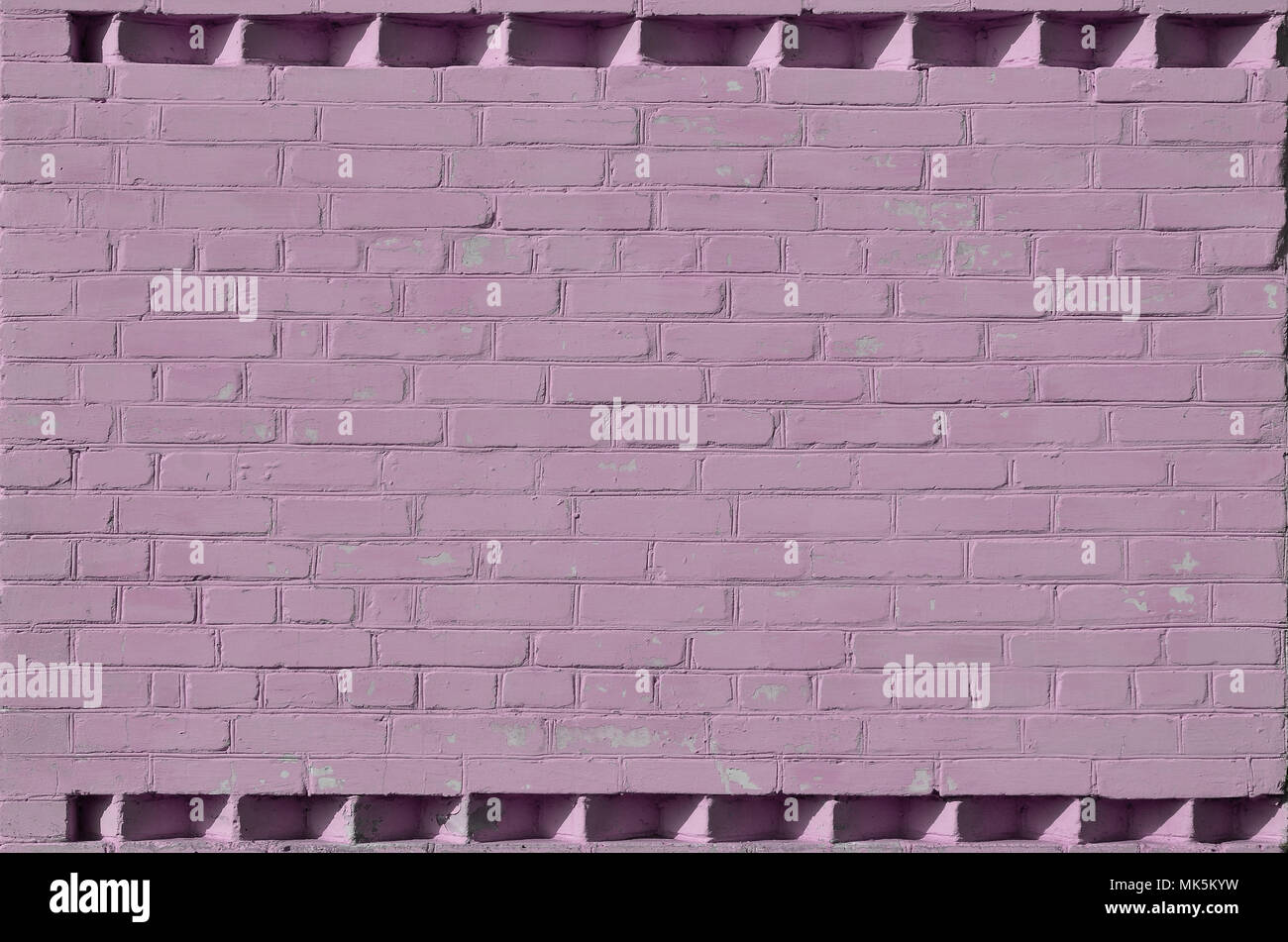The texture of purple wall from a variety of old and dirty brick ...