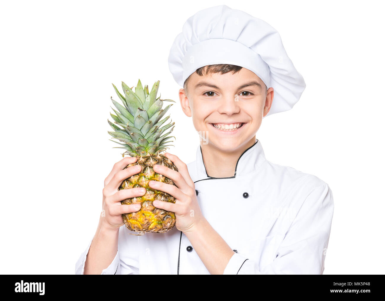 Teen boy wearing chef uniform Stock Photo - Alamy