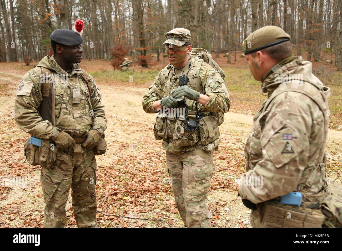 U.S. Army Sgt. 1st Class Derek Castro, center, of the Joint ...