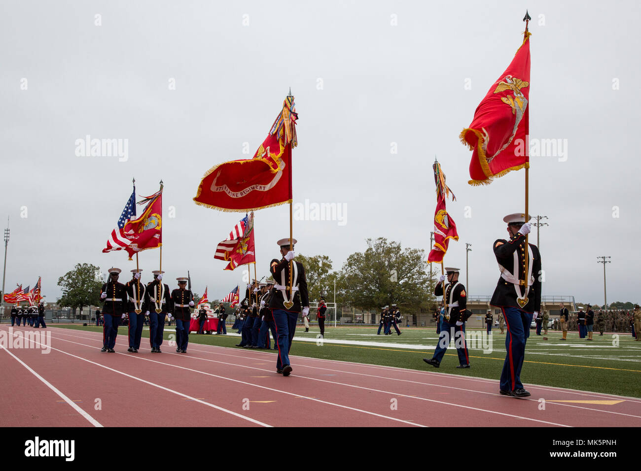 U.S. Marines with color guards from various units march off the colors ...