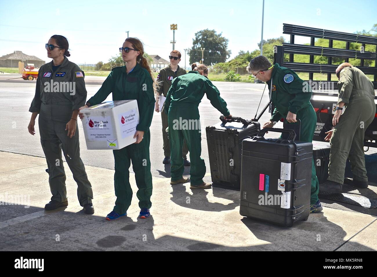 U.S. Coast Guard and Disaster Medical Assistance Team members prepare ...