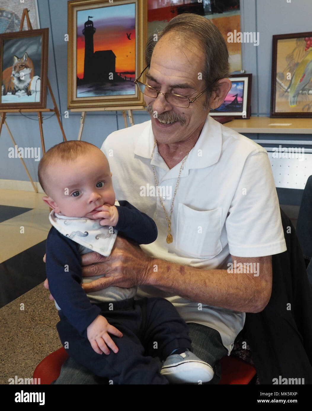 Army Veteran John Roberts wears one of his crafted rock necklaces while ...