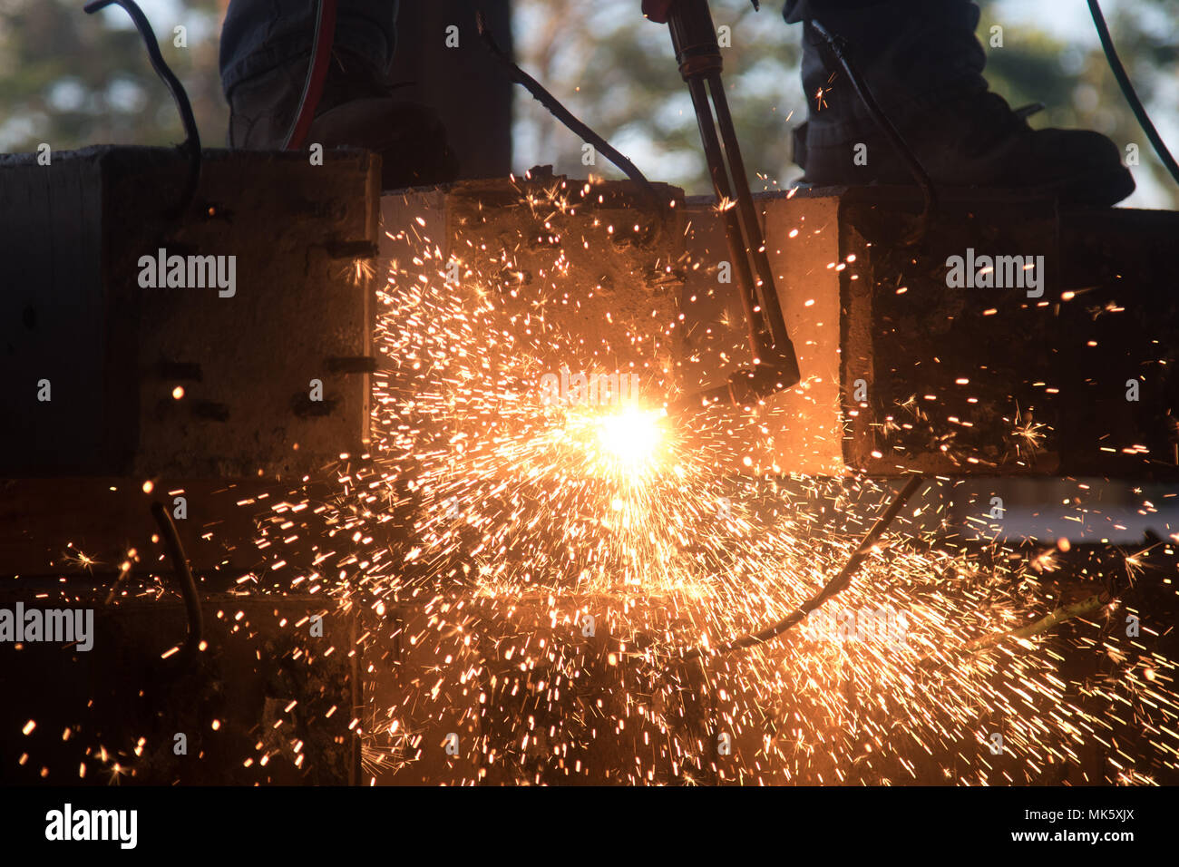 SAN JUAN, Puerto Rico – Sparks fly as a welder works on a heavy-duty ...