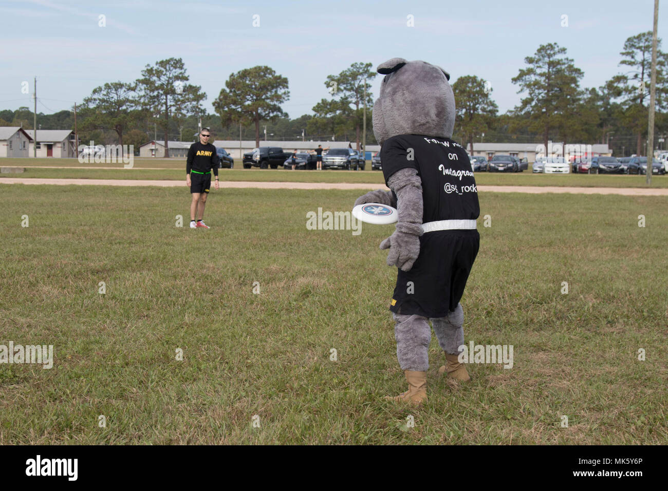 Sgt. Rocky, 3rd Infantry Division's mascot, plays frisbee with Soldiers ...
