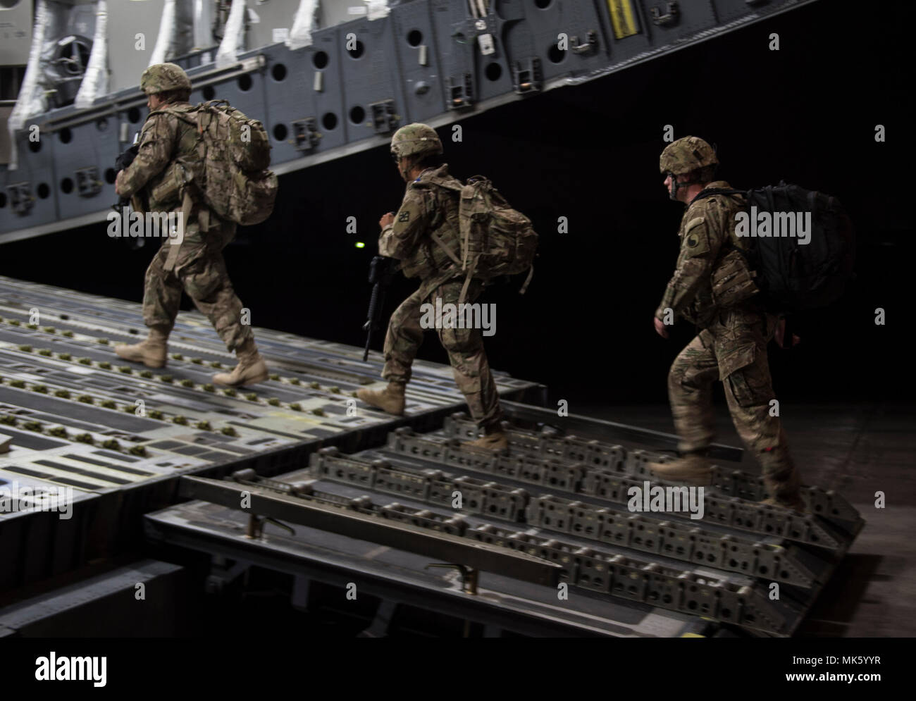 U.S. Army soldiers board a U.S. Air Force C-17 Globemaster III from the ...