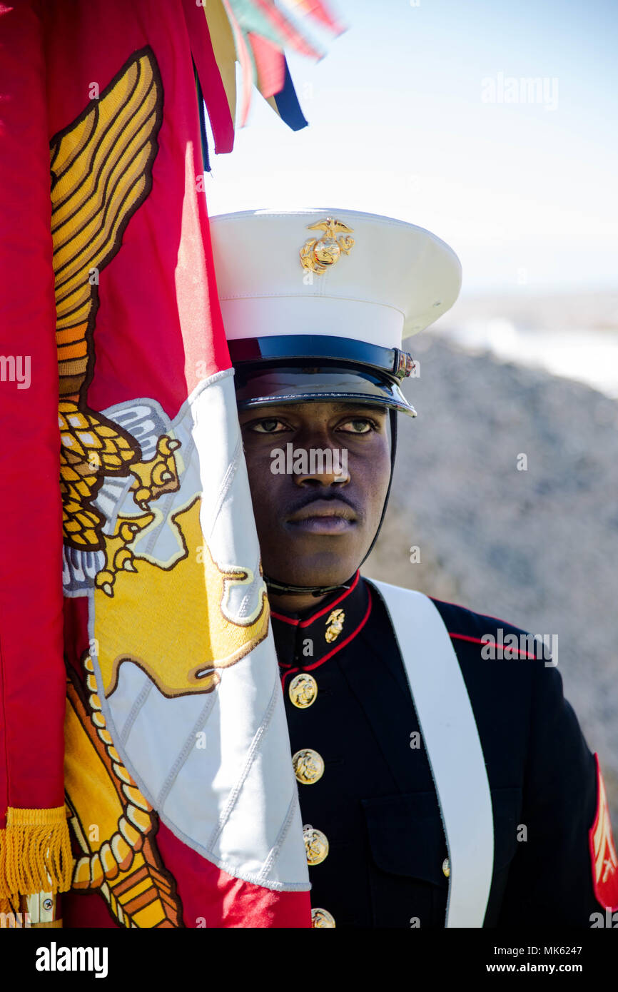 A Marine stands at attention at the end of the Marine Corps Birthday ...