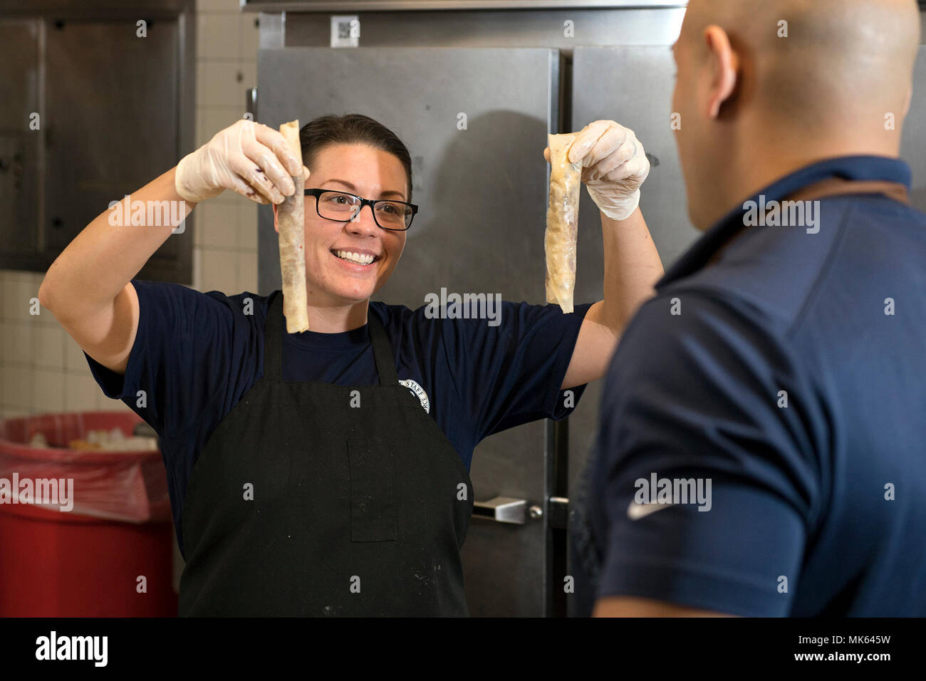 Air Force Staff Sgt. Amber Boyd shows off freshly rolled ham hock ...
