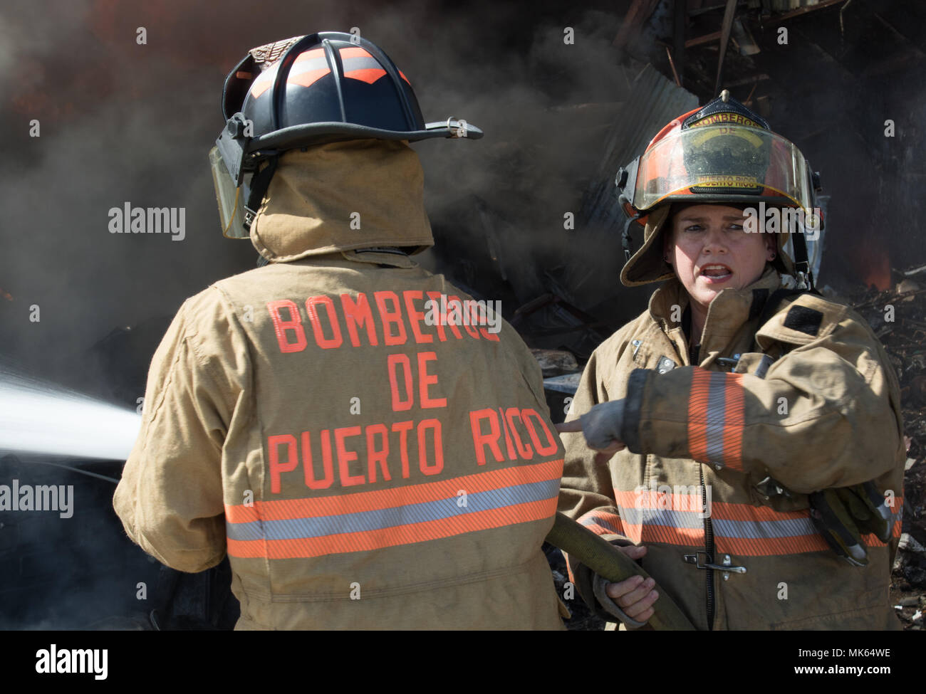 SAN JUAN, Puerto Rico – Firefighters battle a blaze at Homeca Recycling ...