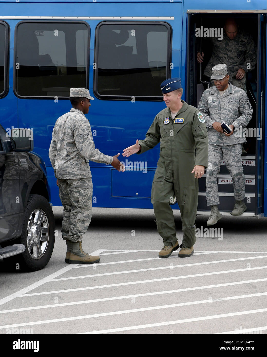 Maj. Gen. Patrick Doherty, the 19th Air Force commander, shakes hands ...