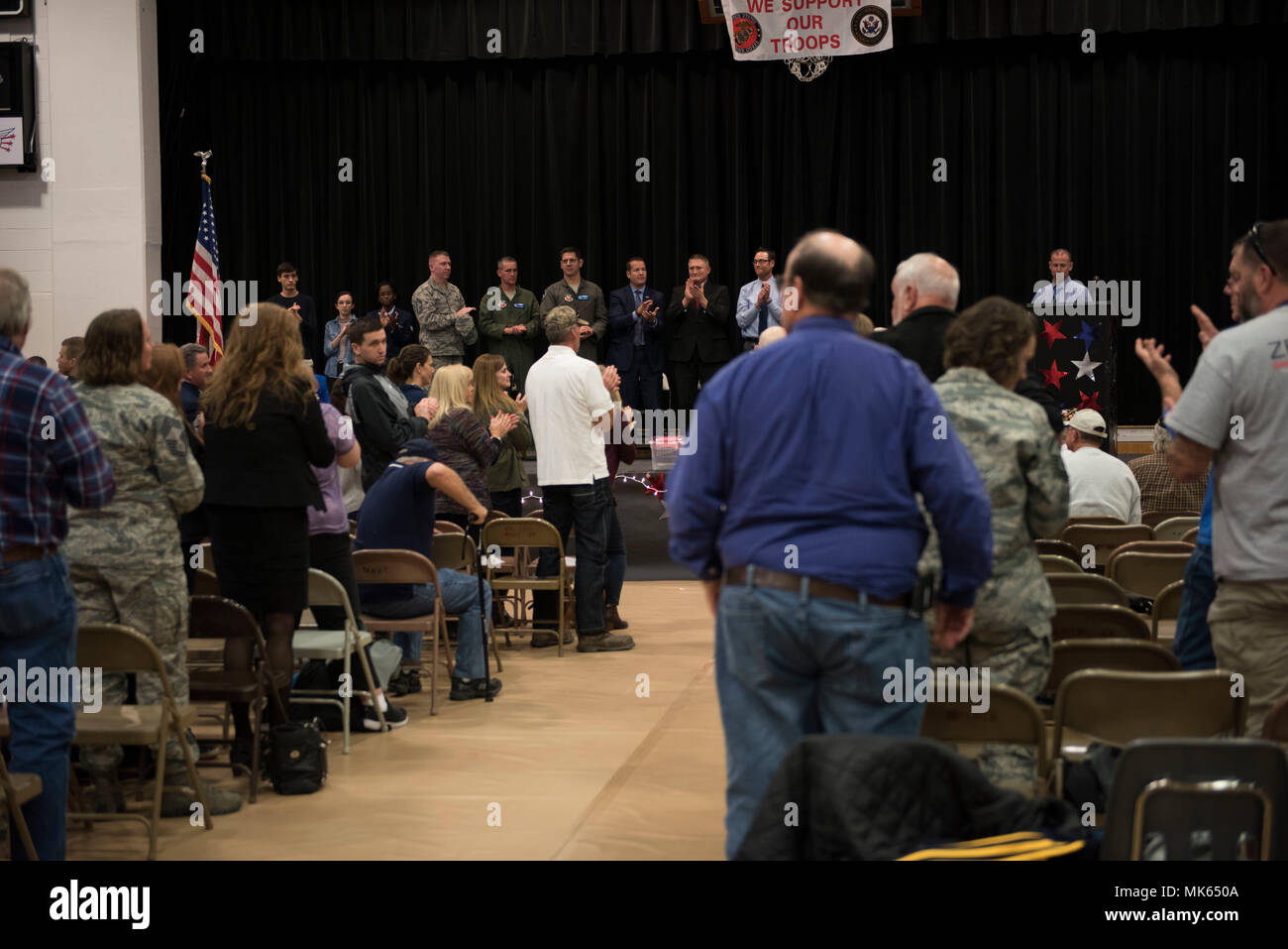Attendees of Mountain Home High School’s Veterans Day ceremony applaud ...