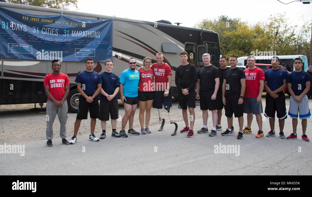 Rob Jones, a Marine Corps veteran, poses for a photo with the Marines ...