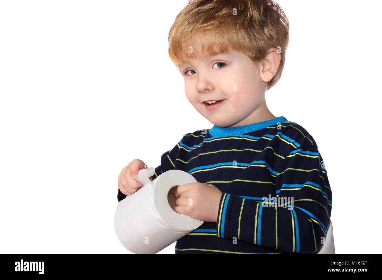 Young boy holding a roll of toilet paper Stock Photo - Alamy