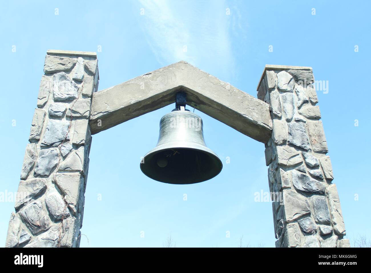 a distant view of a church bell, showing more of the supporting ...