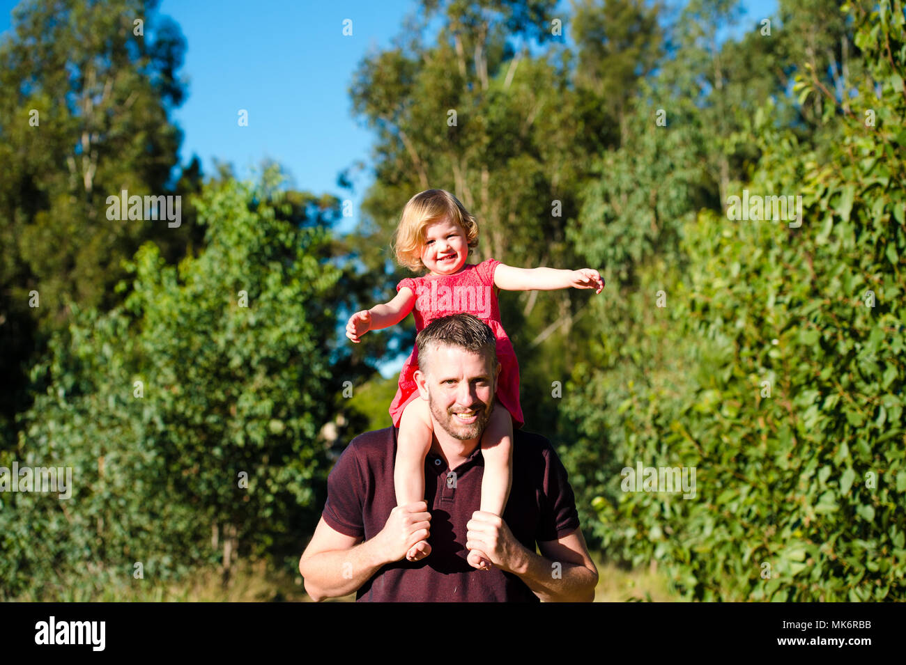 Child sits on shoulders hi-res stock photography and images - Alamy