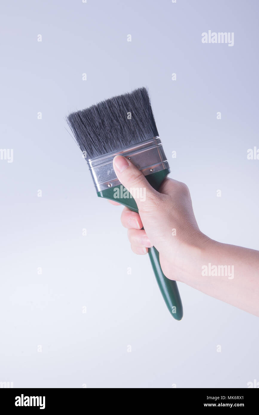 paint brush with hand. paint brush with hand on a background Stock ...