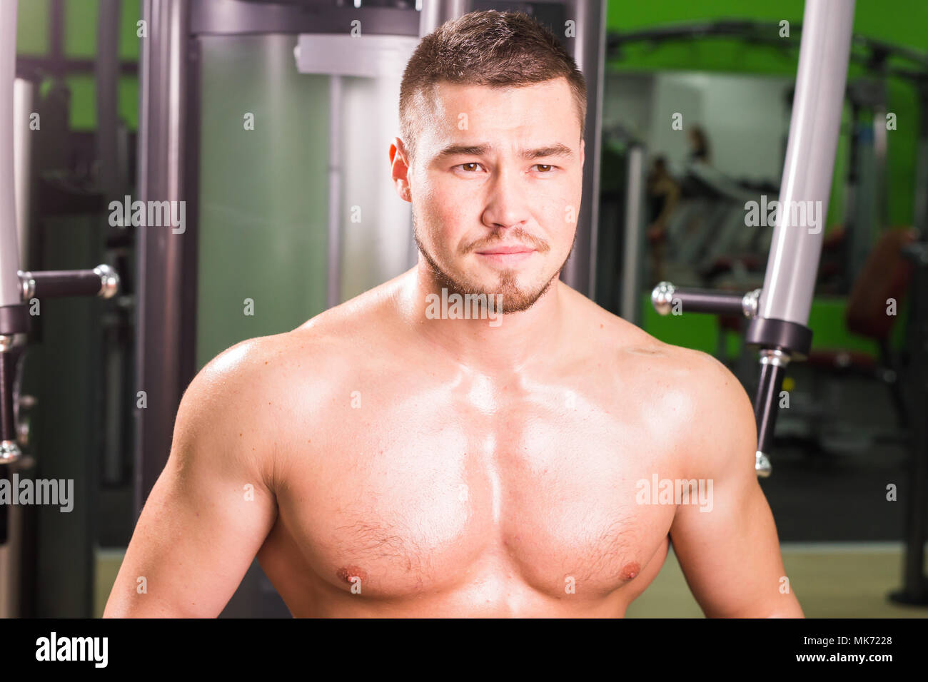 Portrait of muscular mixed race man in gym Stock Photo - Alamy