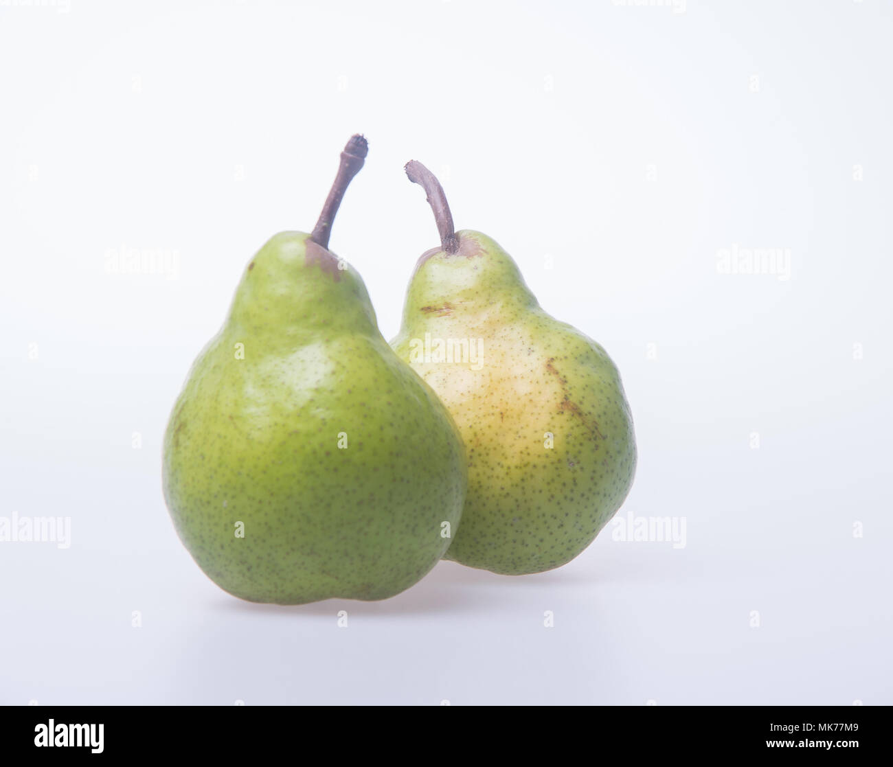 pears or two green pears on a background Stock Photo - Alamy