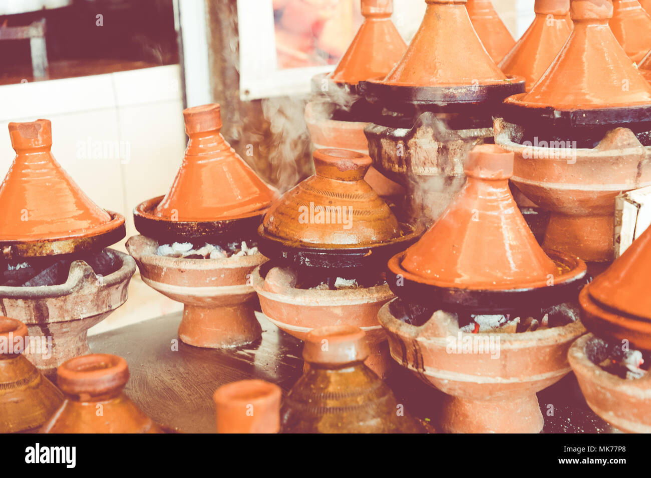 Preparing food in tajin traditional dish in Morocco - meat and ...
