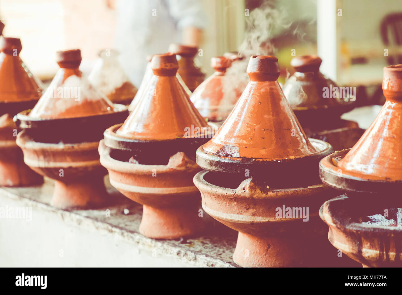 Preparing food in tajin traditional dish in Morocco - meat and ...