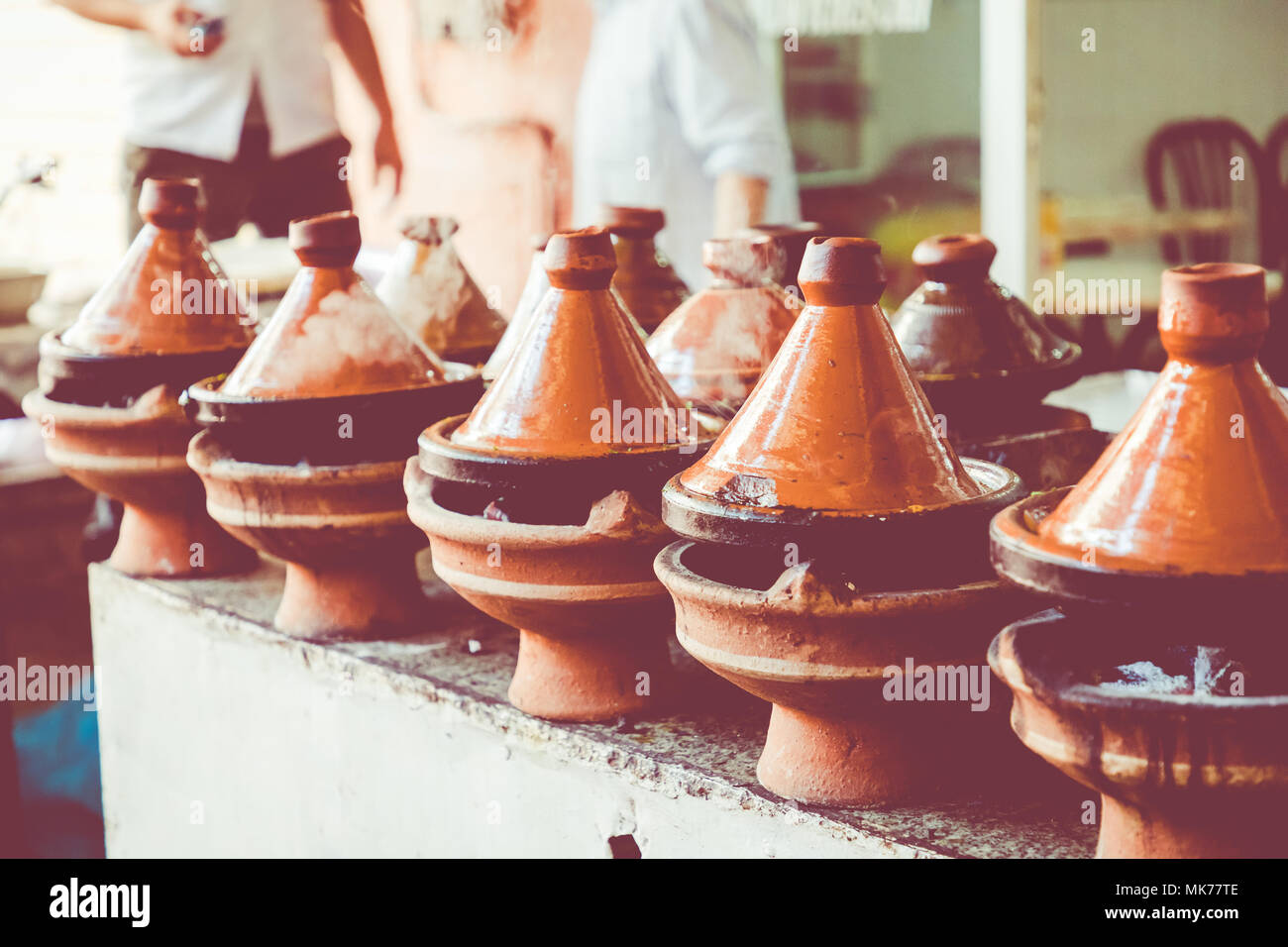 Preparing food in tajin traditional dish in Morocco - meat and ...