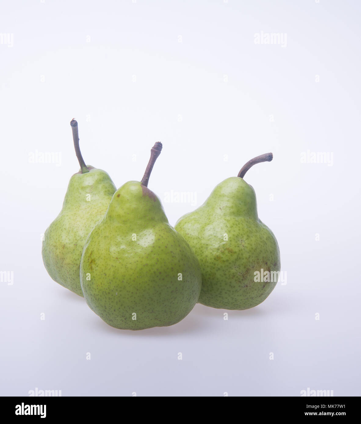 pears or three pears on a background Stock Photo - Alamy