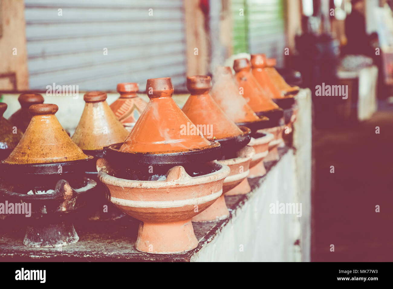 Preparing food in tajin traditional dish in Morocco - meat and ...