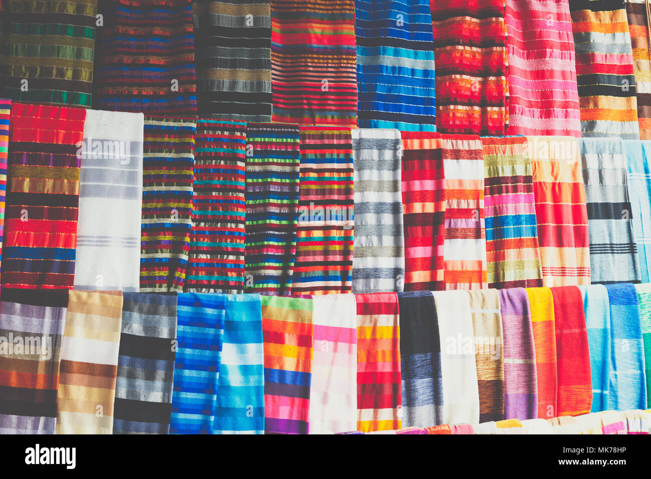 Selection of colorfu clothes on a traditional Moroccan market (souk) in ...