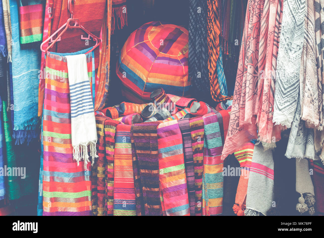 Selection of colorfu clothes on a traditional Moroccan market (souk) in ...