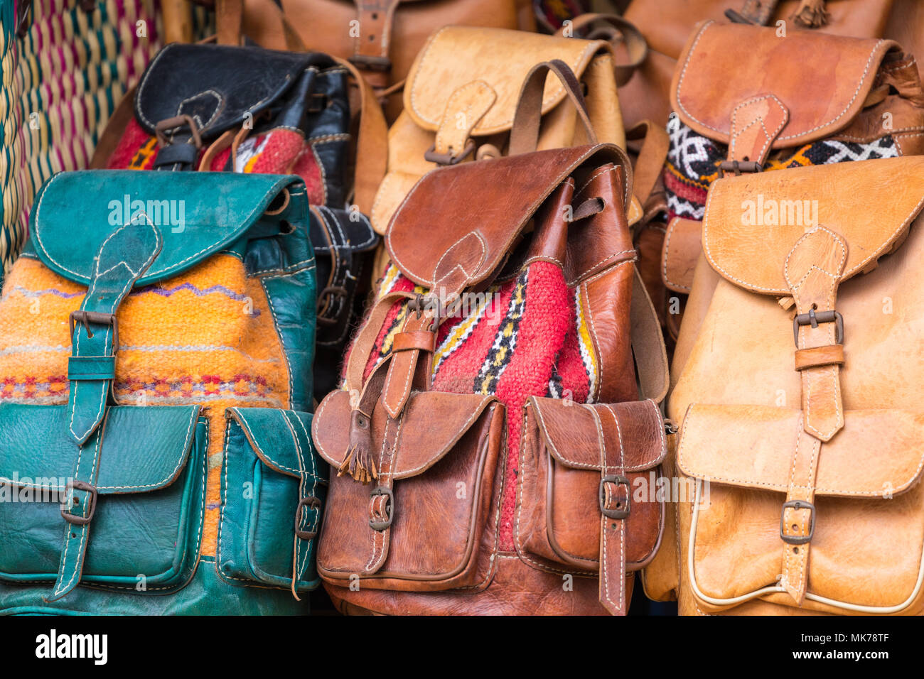 Moroccan leather goods bags and slippers at outdoor market in Marrakesh ...