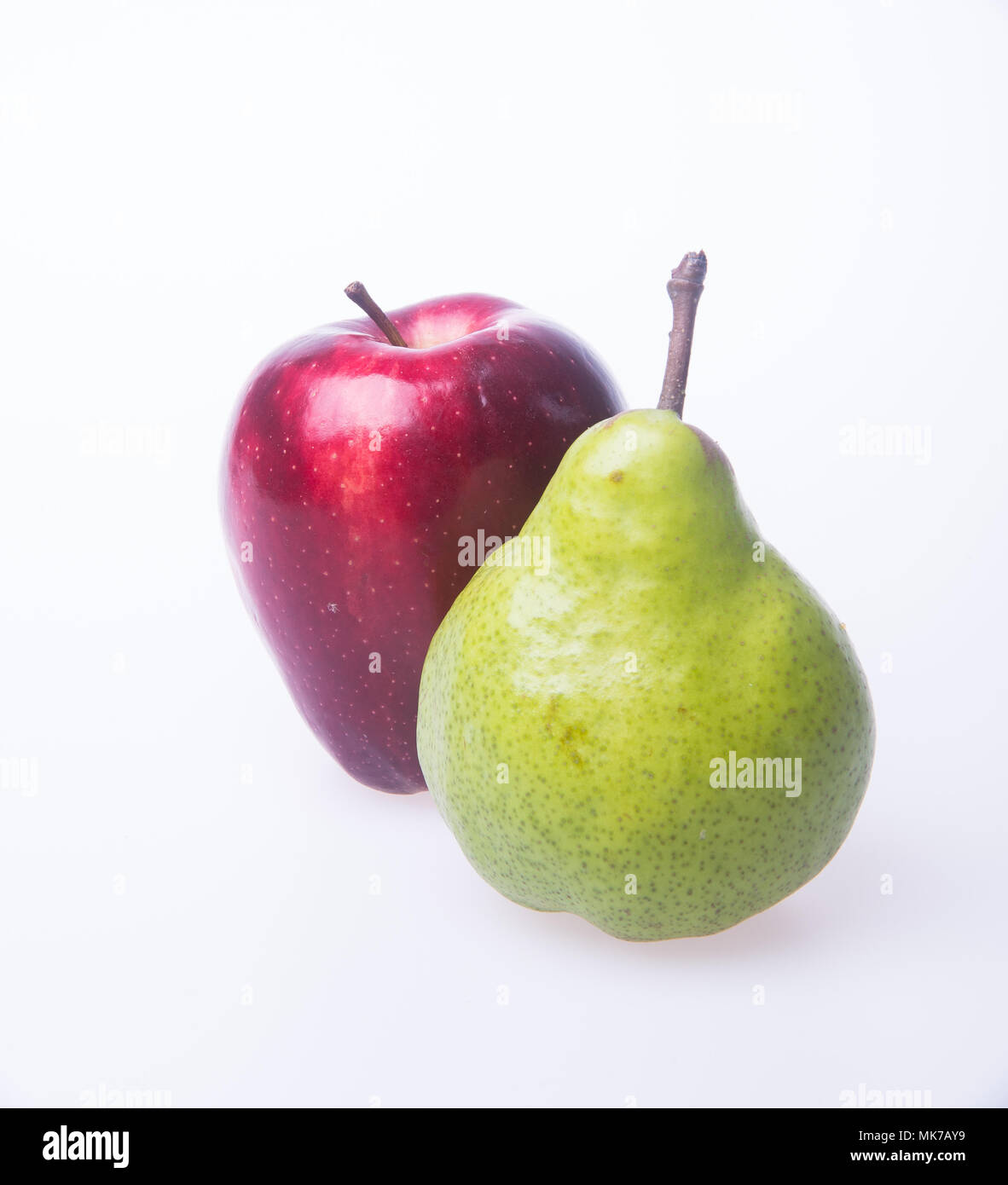 red apple and green pear on a background Stock Photo - Alamy